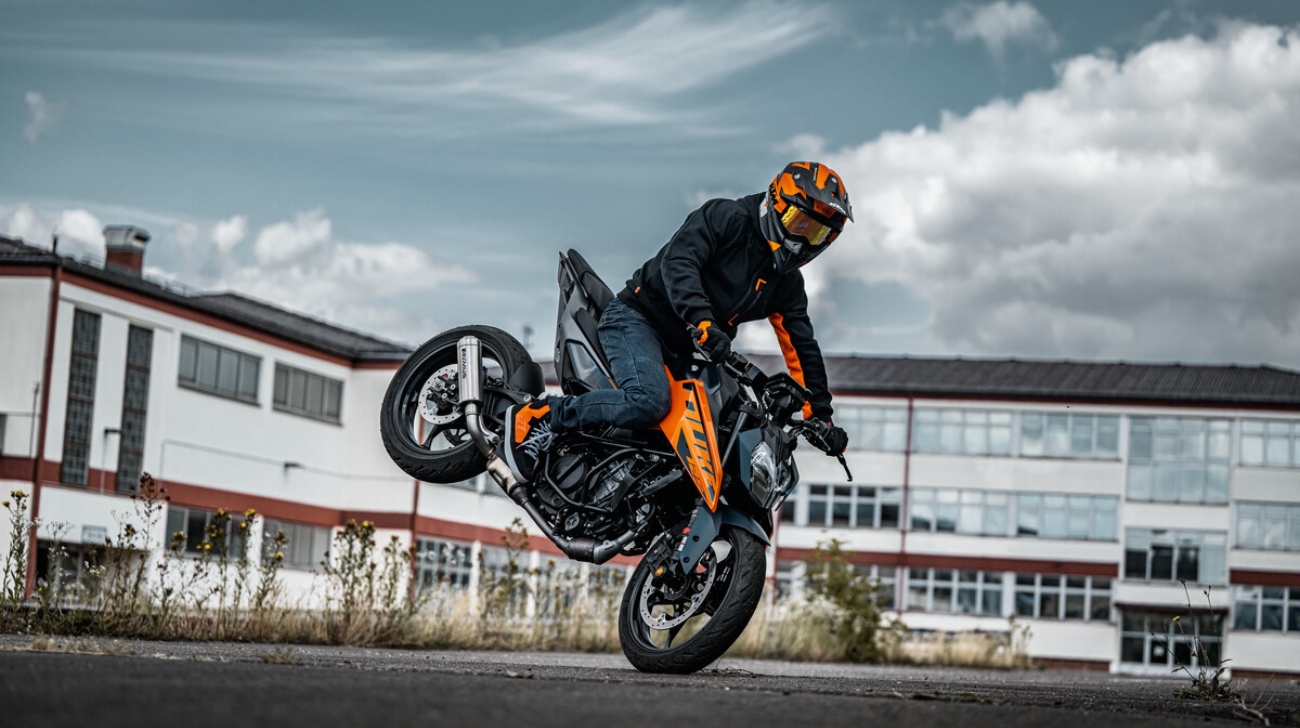 How does KTM AG's $3 billion debt affect Bajaj Auto India